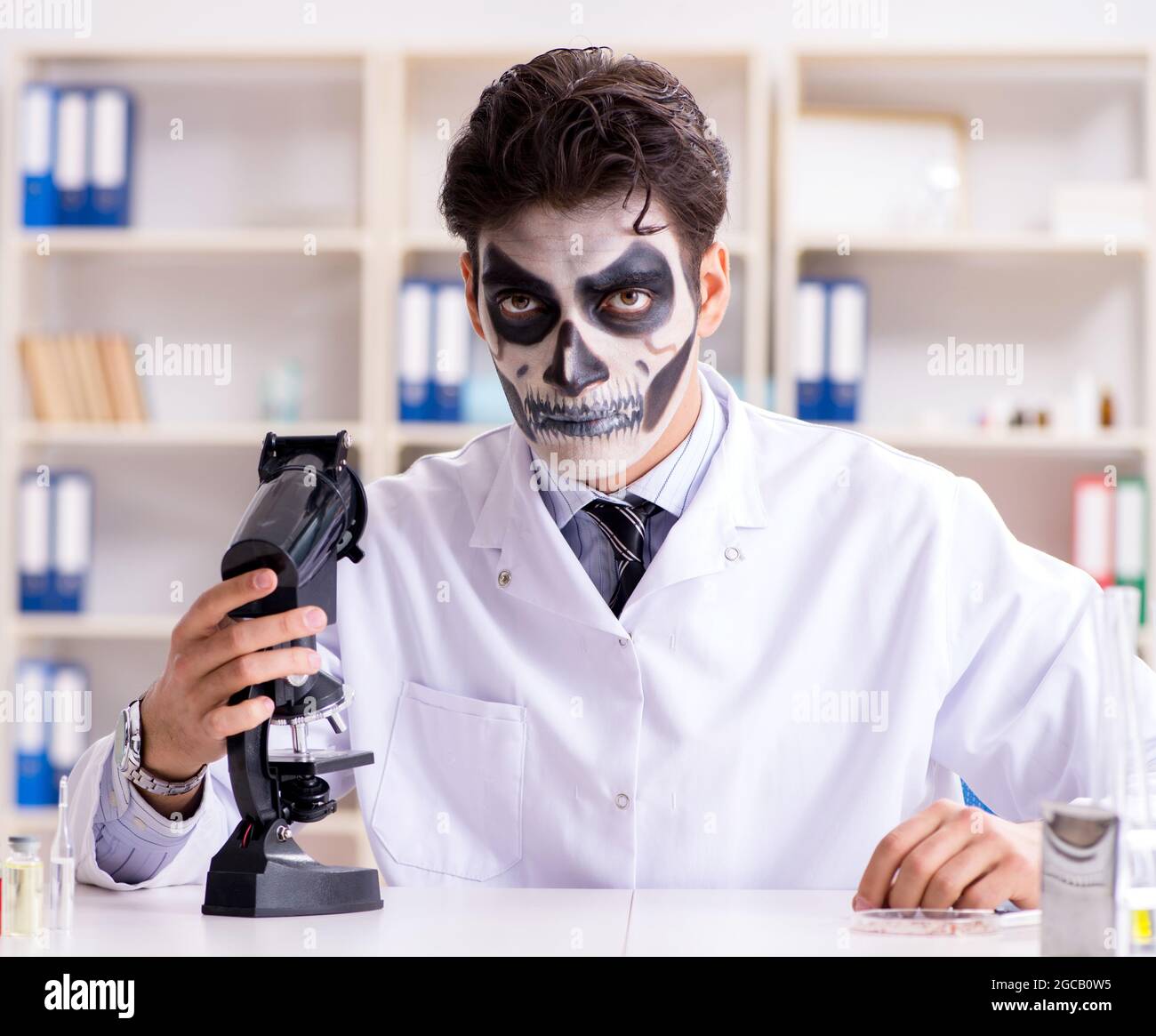 The scary monster doctor working in lab Stock Photo - Alamy