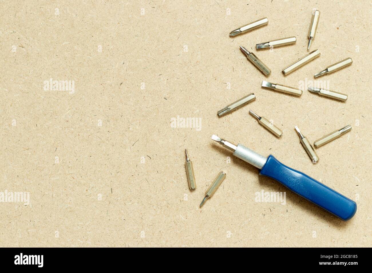 Screwdriver with screw head tip on wood background with copy space ...