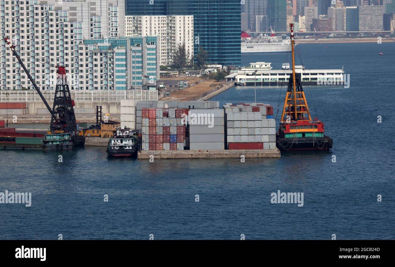 Barges being loaded at a container terminal in Hong Kong Stock Photo ...