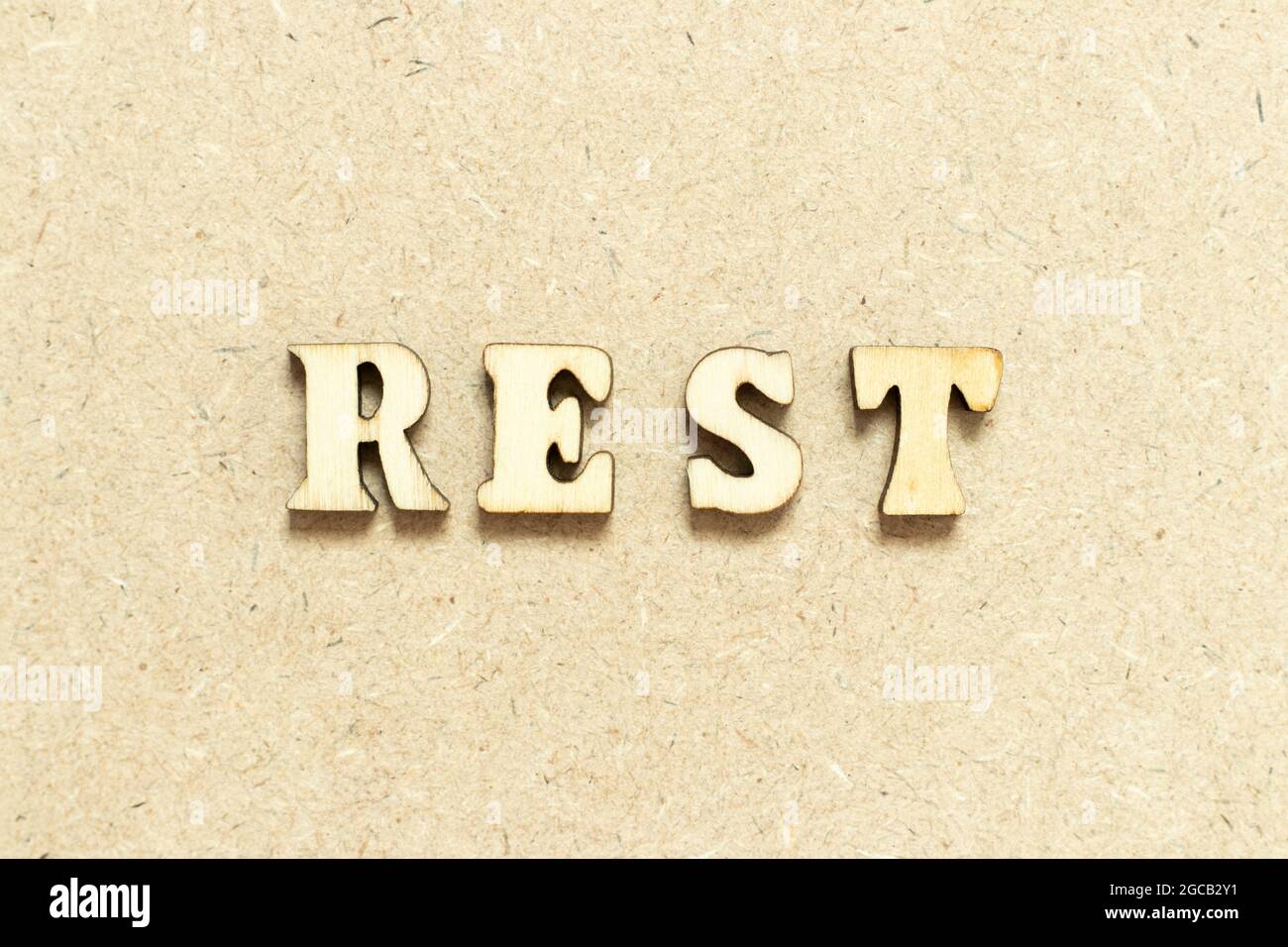 Alphabet letter in word rest on wood background Stock Photo - Alamy