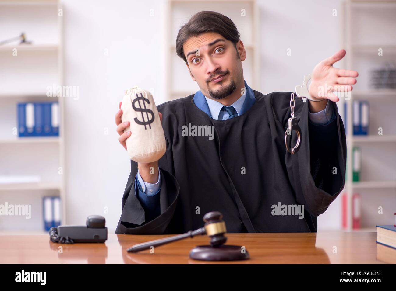 Young judge working in the courtroom Stock Photo - Alamy