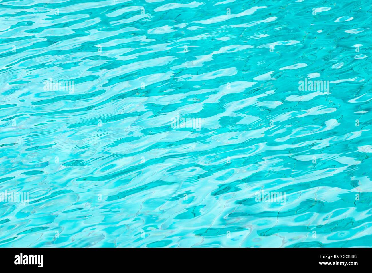 Ripple Water in swimming pool with blue tile floor background Stock ...