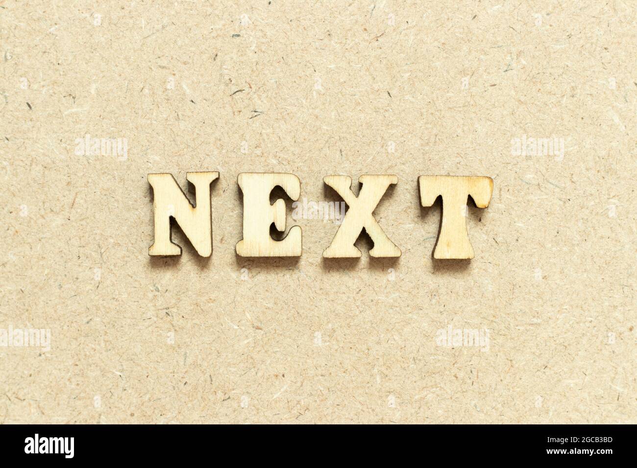 Alphabet letter in word next on wood background Stock Photo - Alamy