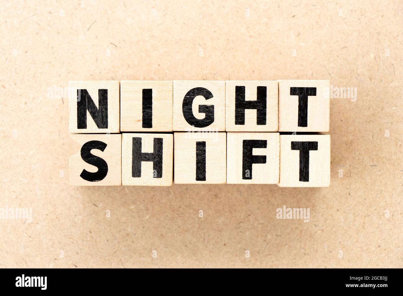 Alphabet letter block in word night shift on wood background Stock ...
