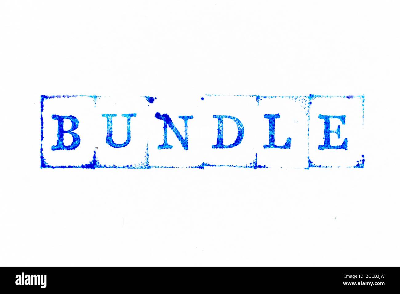 Blue color ink rubber stamp in word bundle on white paper background ...