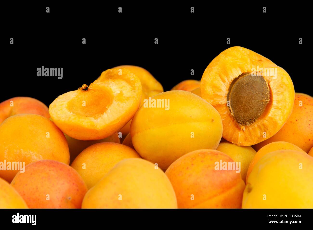 Fresh natural apricot on black background Stock Photo - Alamy