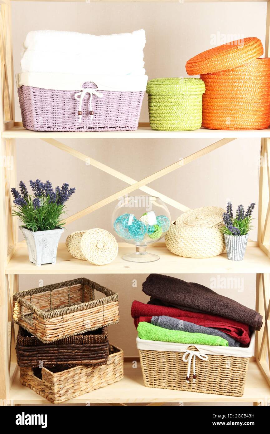 Beautiful white shelves with different home related objects, on color ...