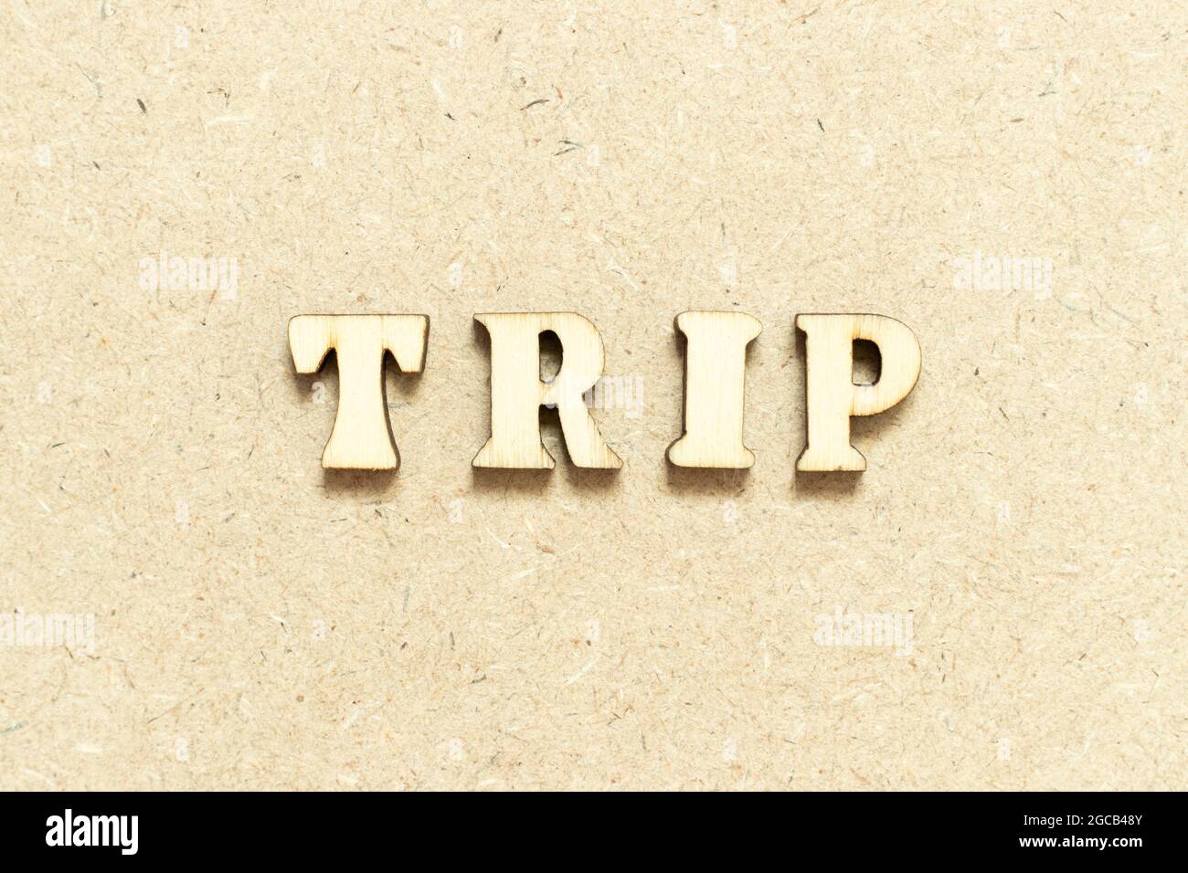 Alphabet letter in word trip on wood background Stock Photo - Alamy
