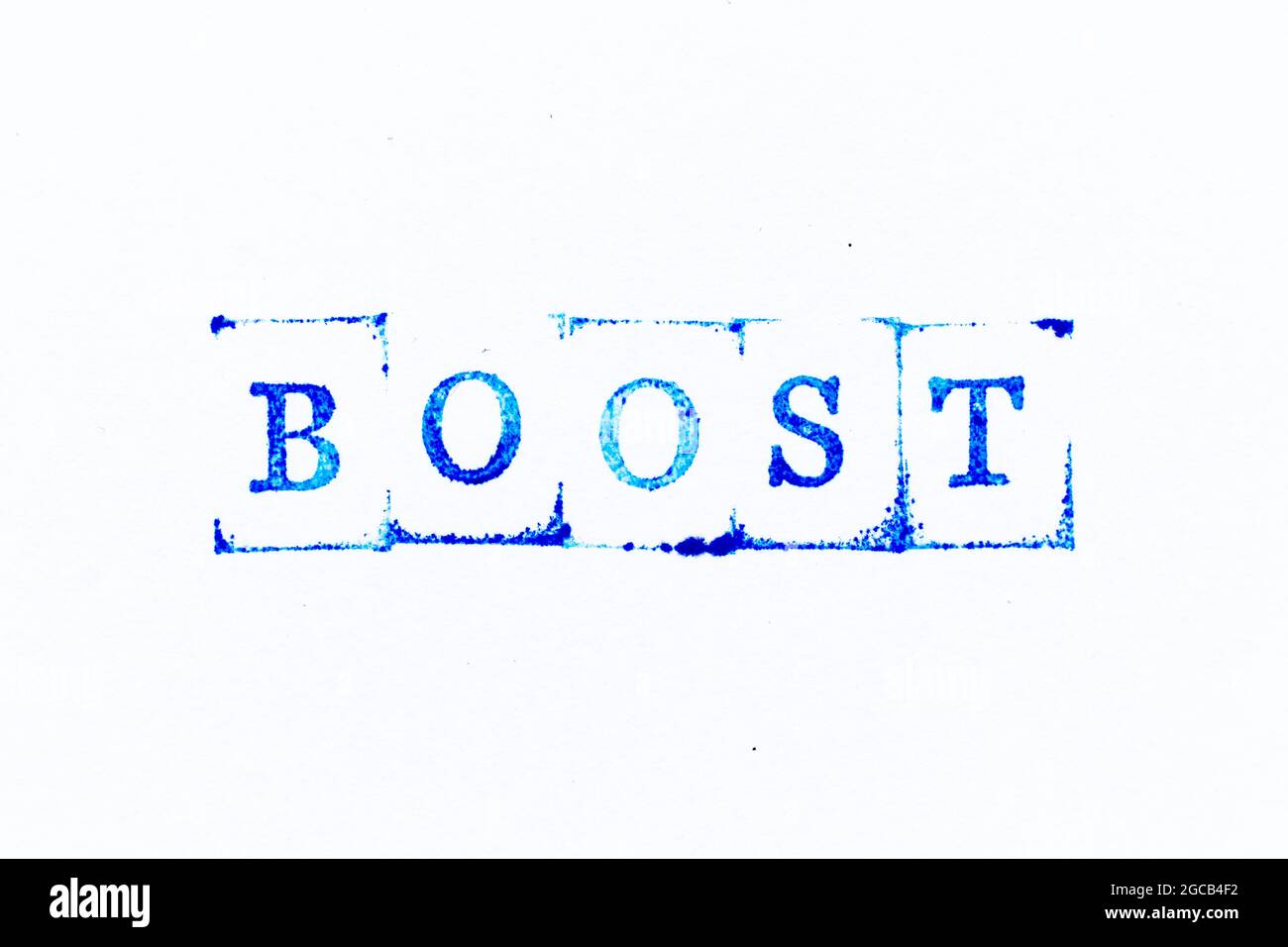 Blue color ink rubber stamp in word boost on white paper background ...