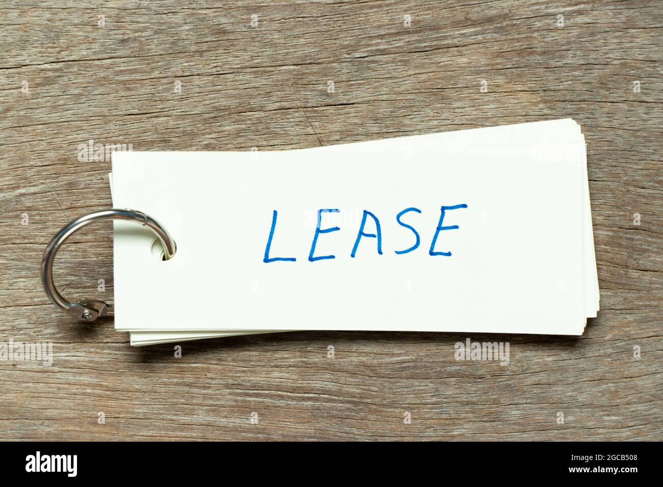 Flash card with handwriting word lease on wood background Stock Photo ...