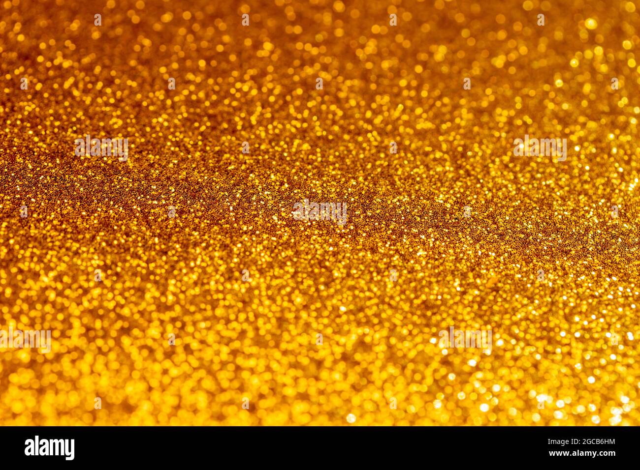Shimmering gold glitter macro texture background with vibrant autumn ...