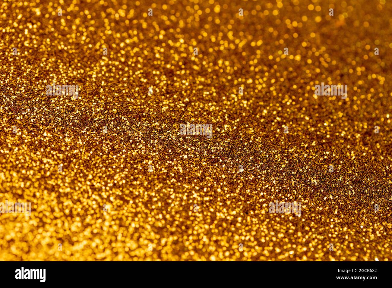 Shimmering gold glitter macro texture background with vibrant autumn ... Shimmering gold glitter macro texture background with vibrant autumn ...