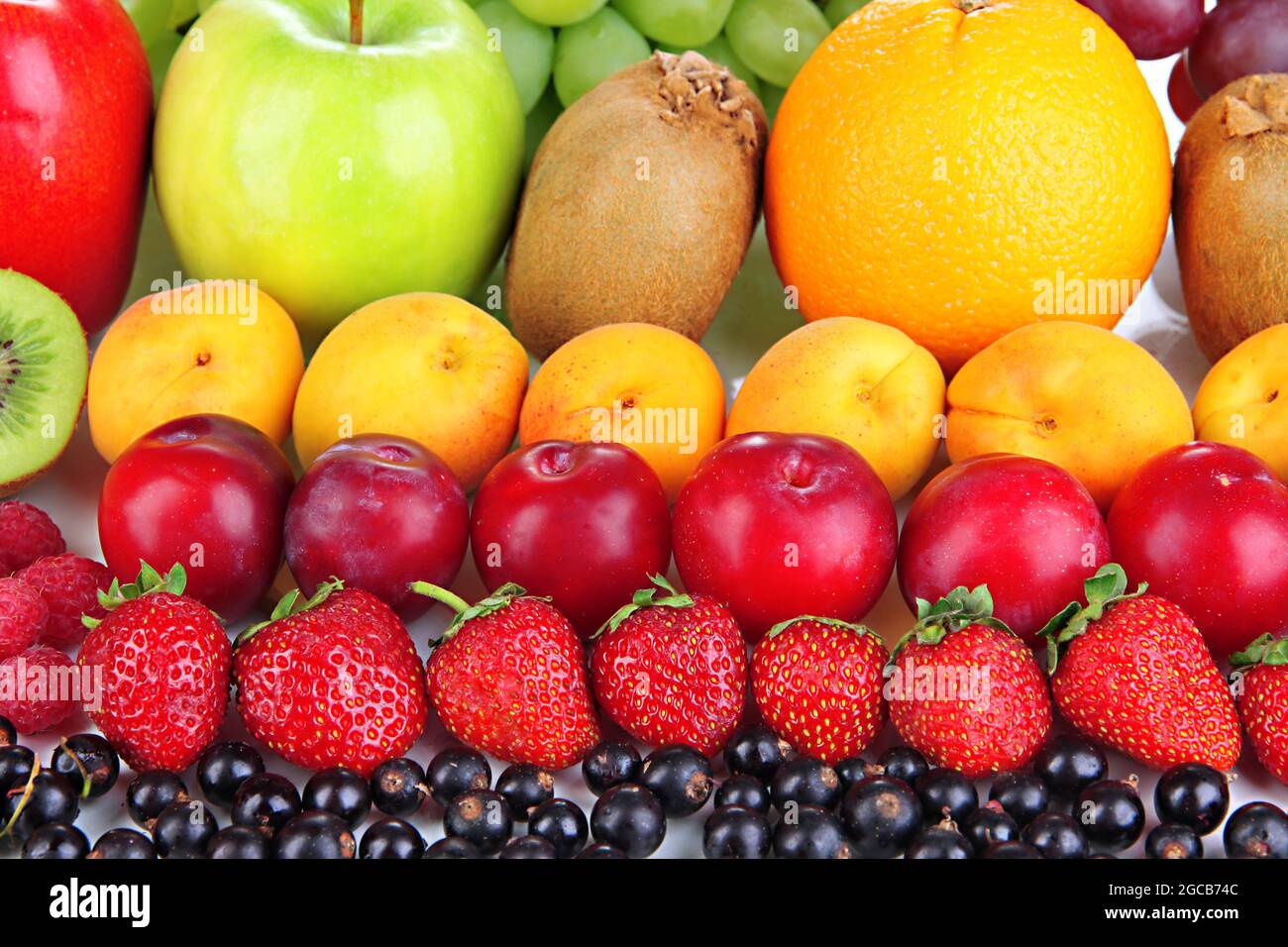 Fresh fruits and berries close up Stock Photo - Alamy