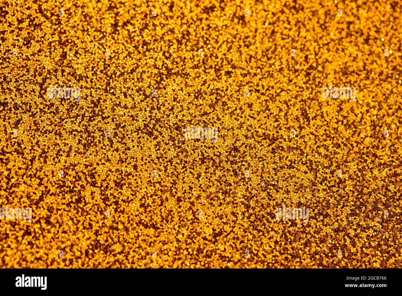 Shimmering gold glitter macro texture background with vibrant autumn ... Shimmering gold glitter macro texture background with vibrant autumn ...