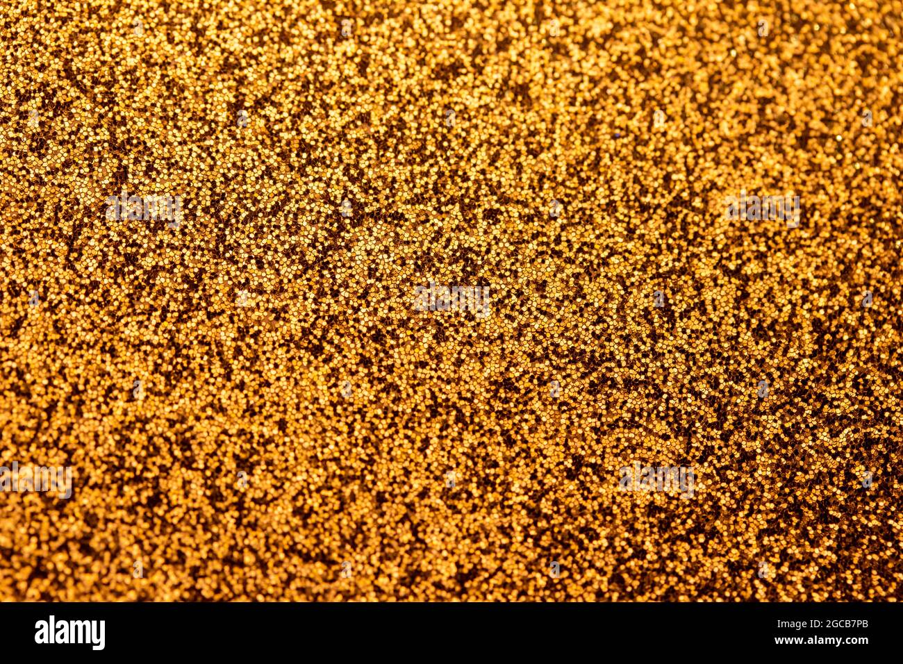 Shimmering gold glitter macro texture background with vibrant autumn ... Shimmering gold glitter macro texture background with vibrant autumn ...