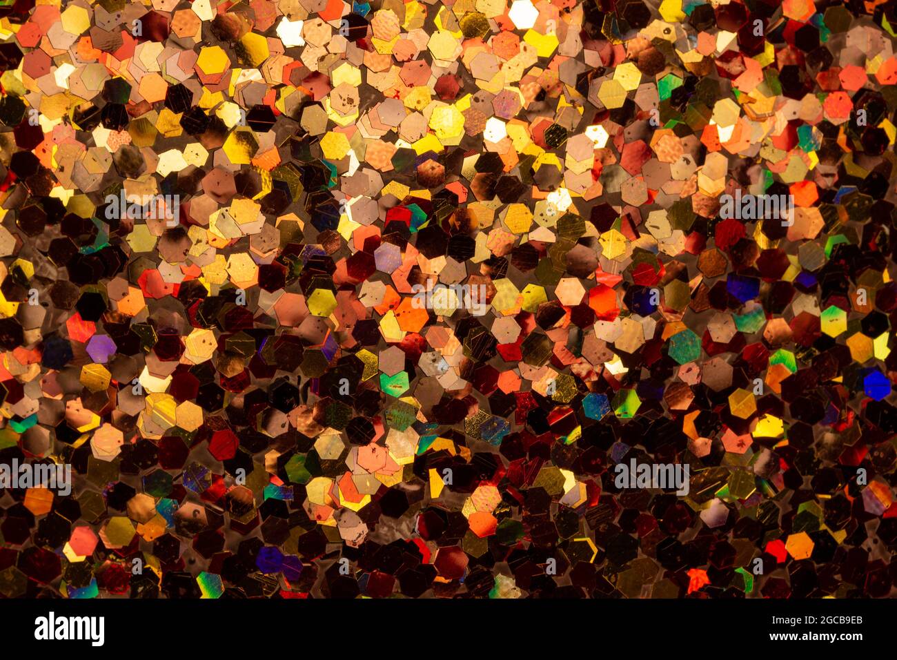 Sparkling red glitter macro texture background with vibrant autumn ...