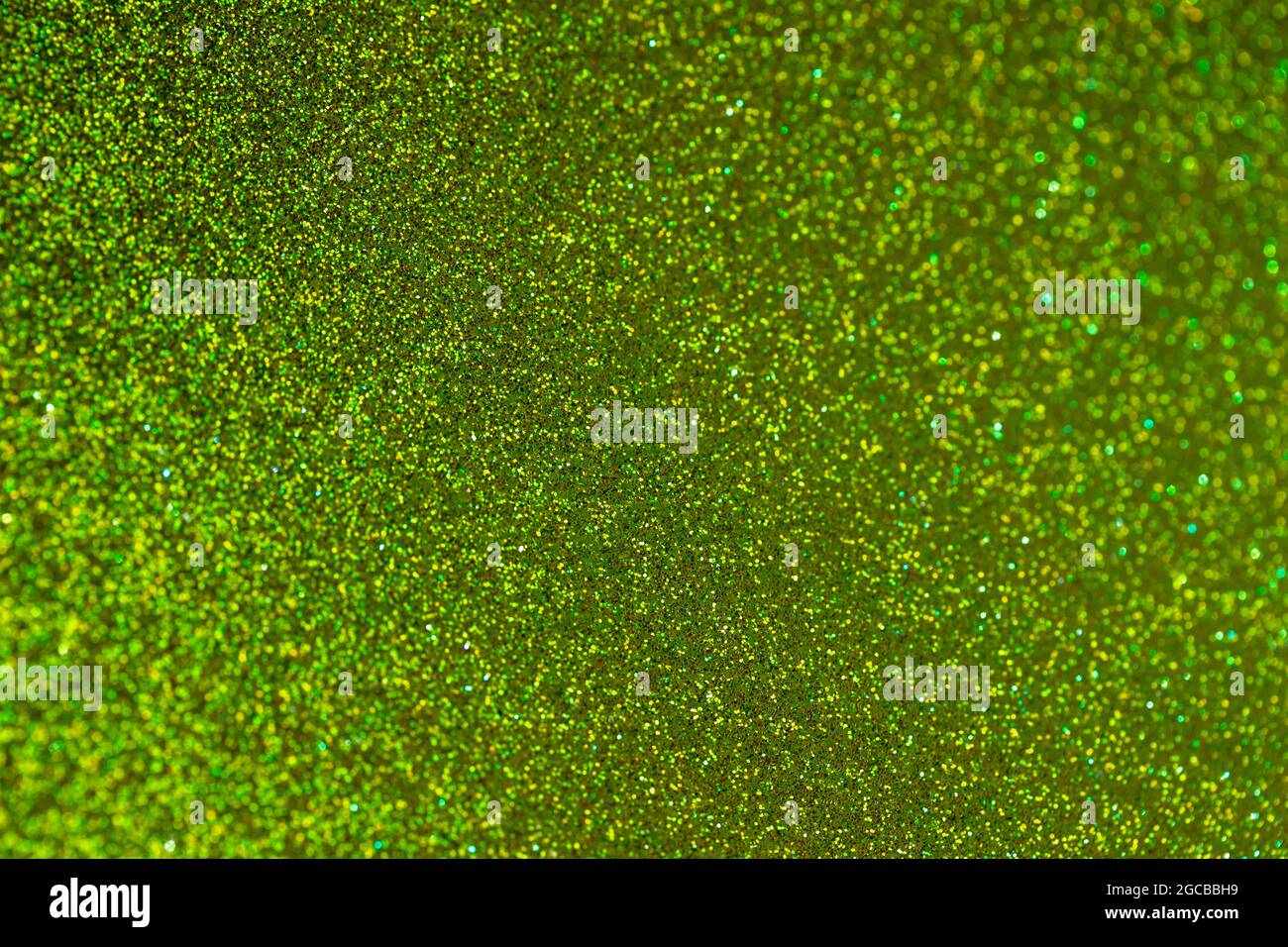 Shimmering green glitter macro texture background with vibrant autumn ...