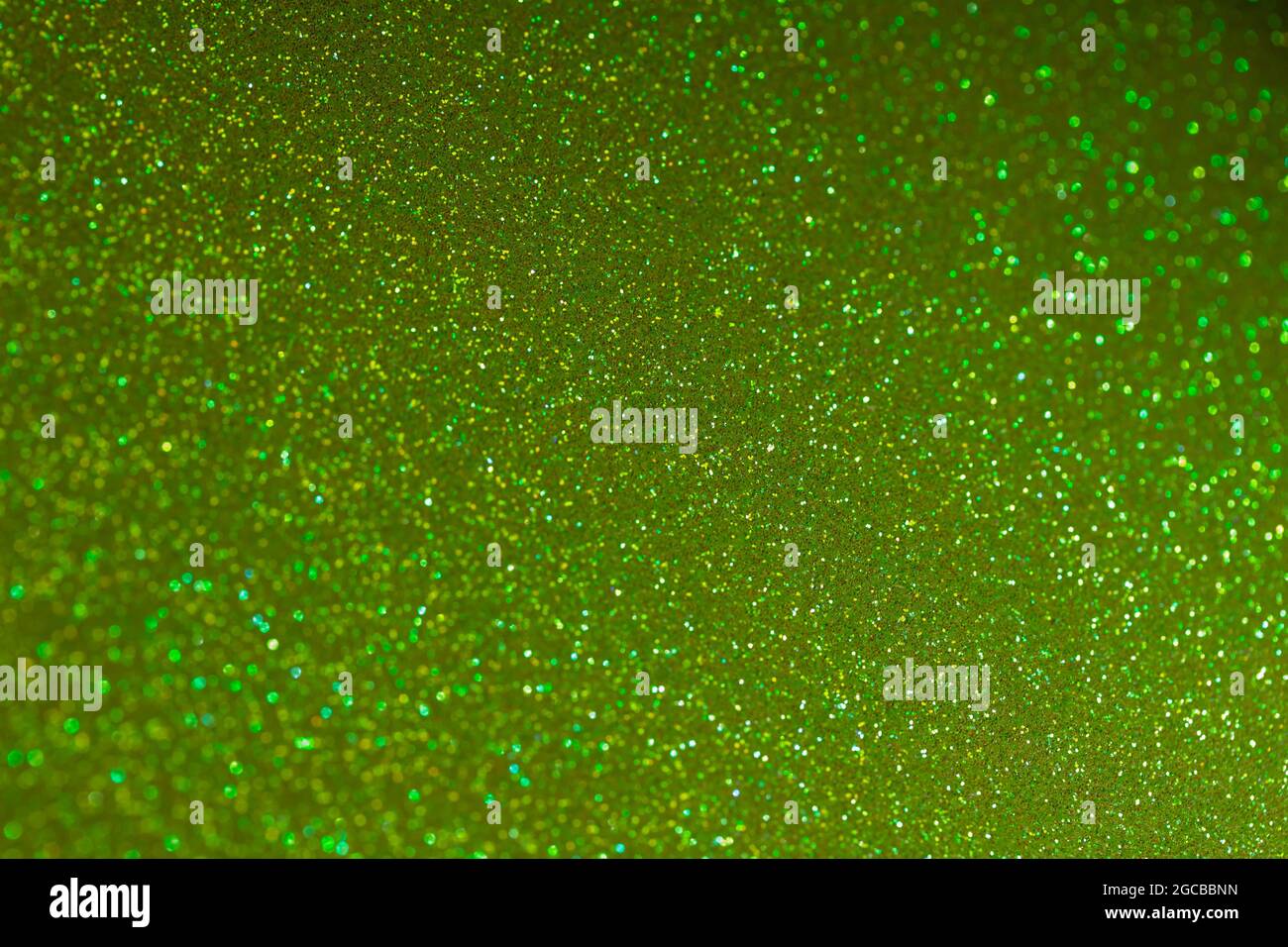 Shimmering green glitter macro texture background with vibrant autumn ...