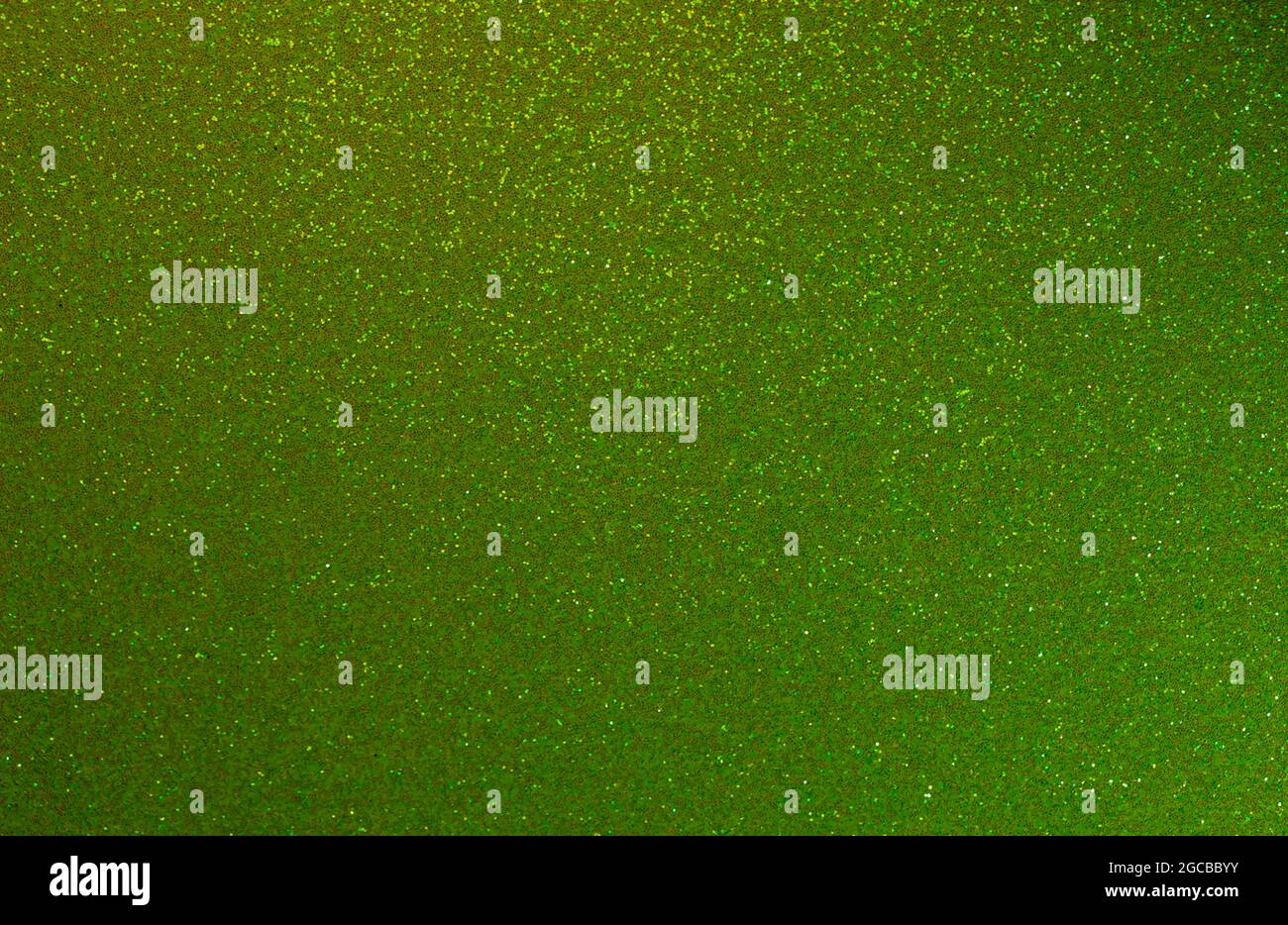 Shimmering green glitter macro texture background with vibrant autumn ...