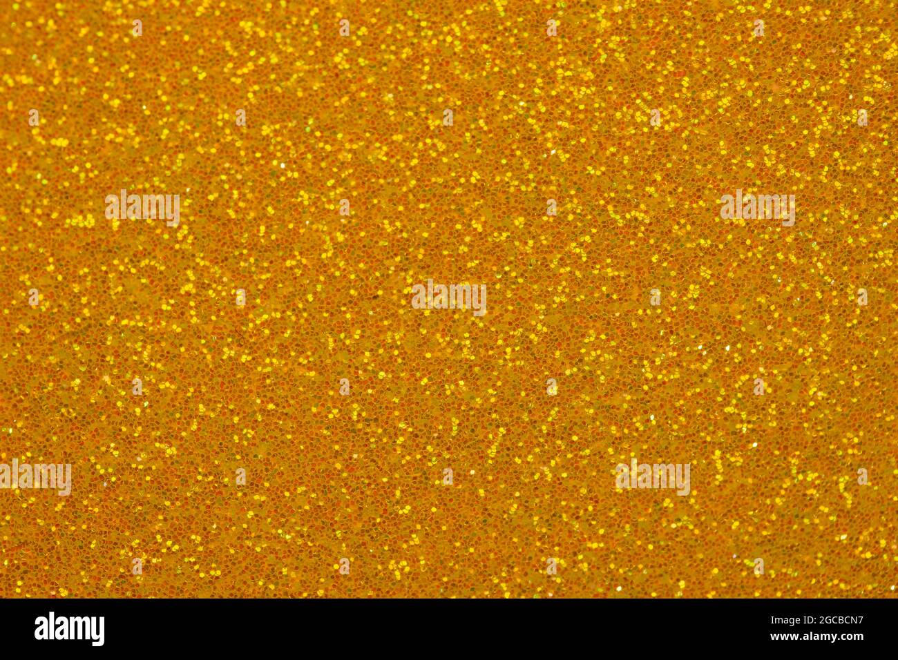 Shimmering gold glitter macro texture background with vibrant autumn ... Shimmering gold glitter macro texture background with vibrant autumn ...