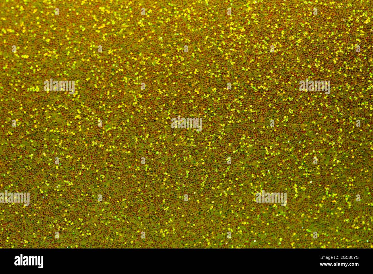 Shimmering gold glitter macro texture background with vibrant autumn ...