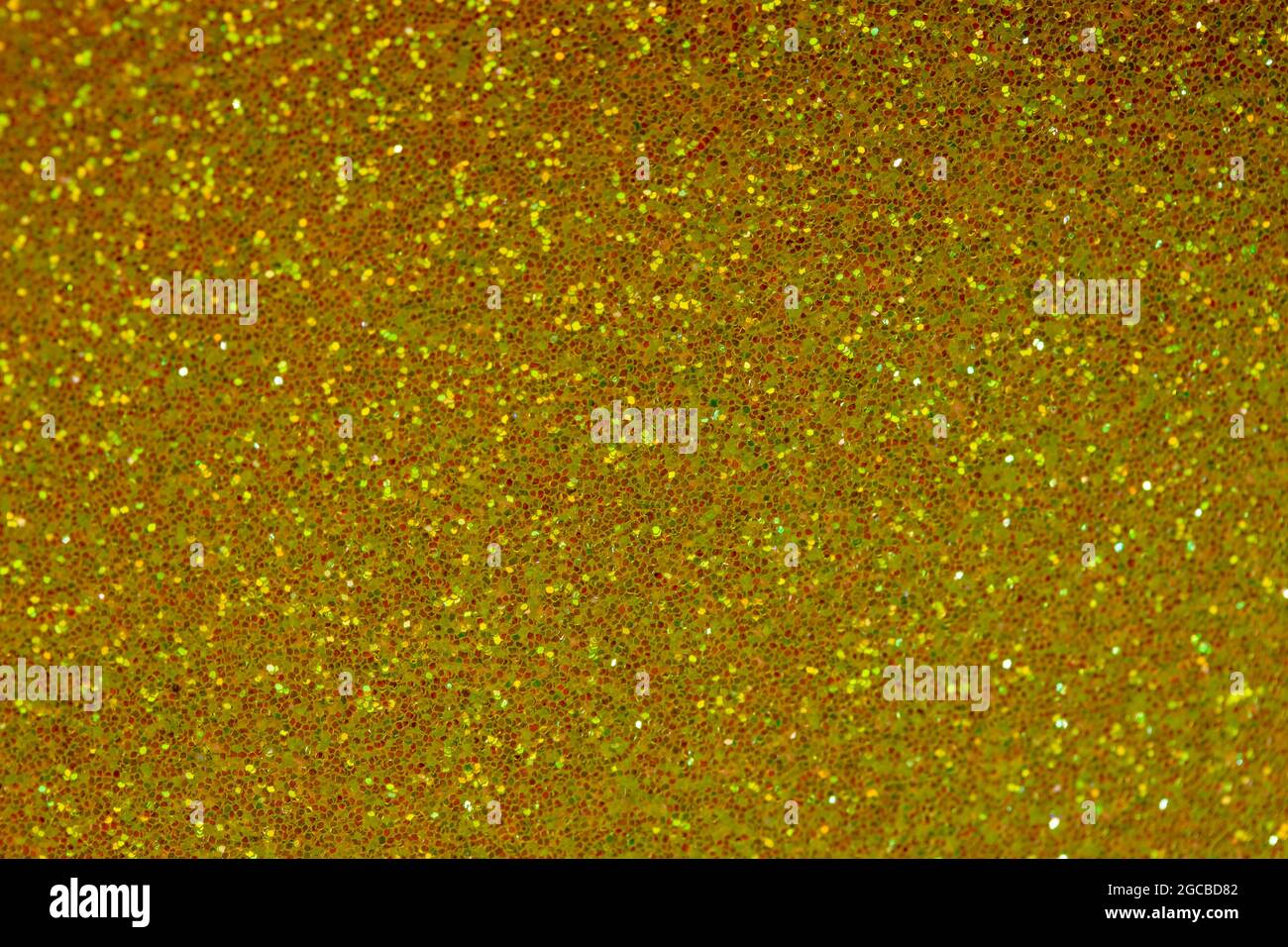 Shimmering gold glitter macro texture background with vibrant autumn ...