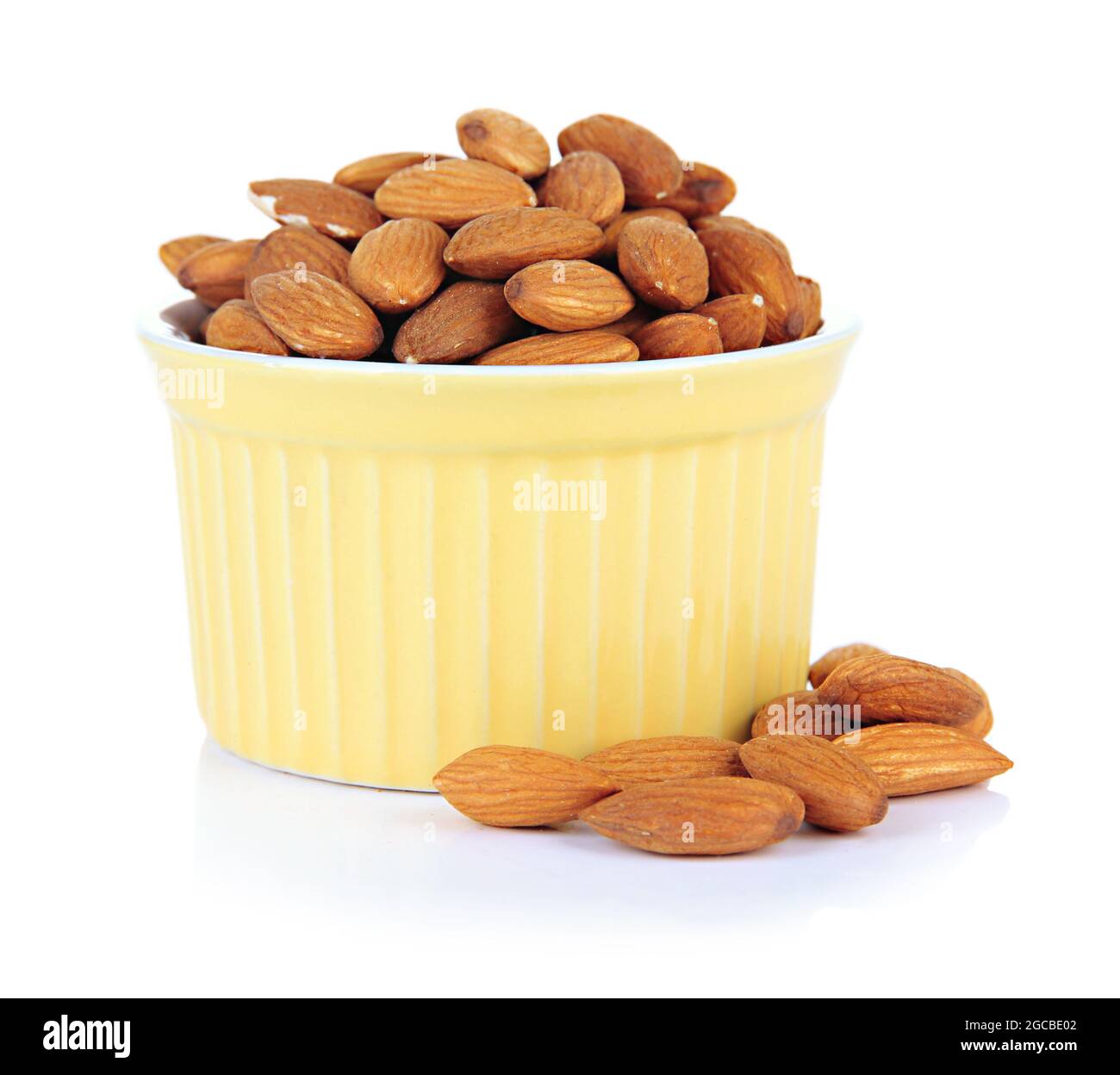 Almond in bowl, isolated on white Stock Photo - Alamy