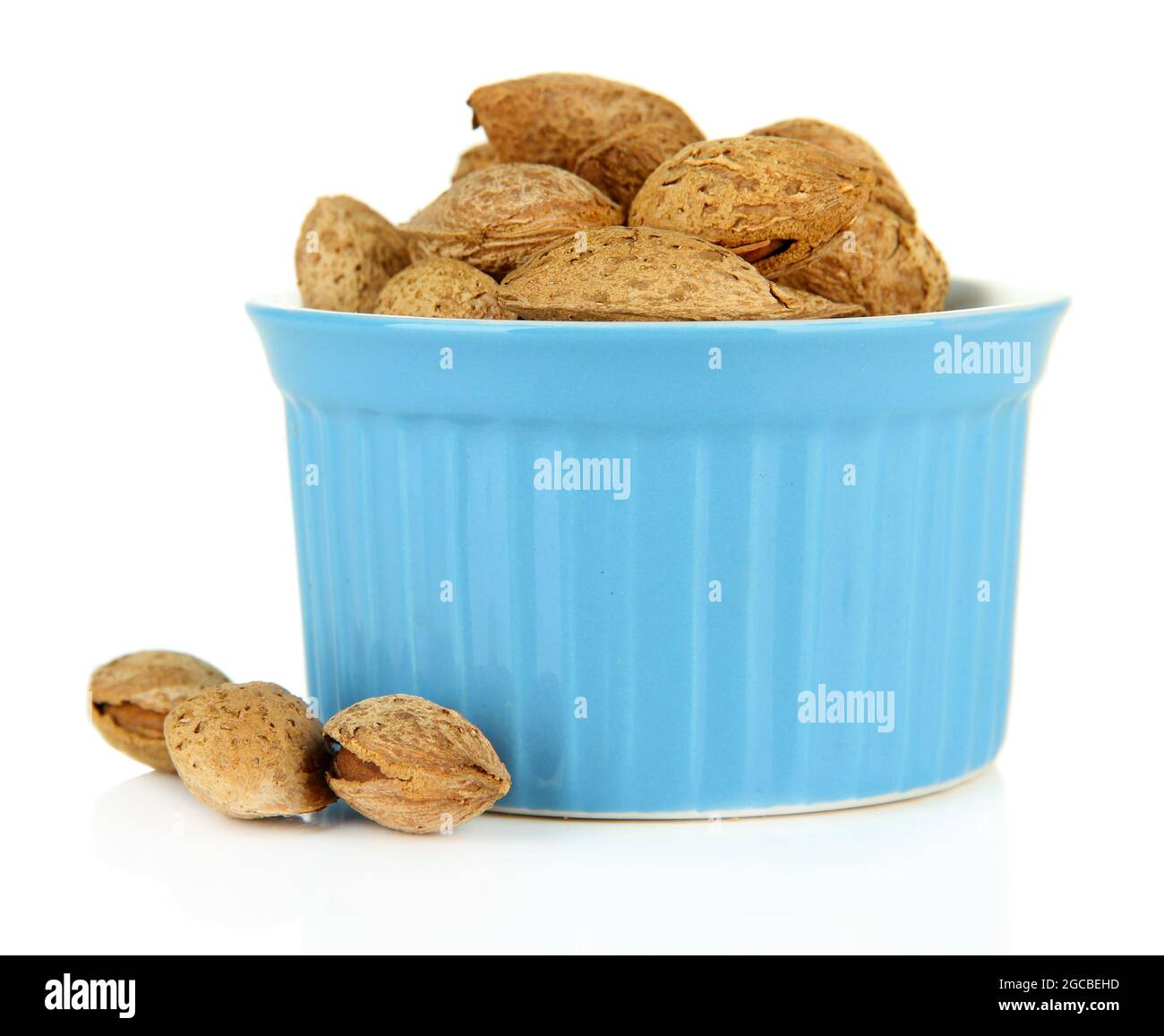 Almond in bowl, isolated on white Stock Photo - Alamy