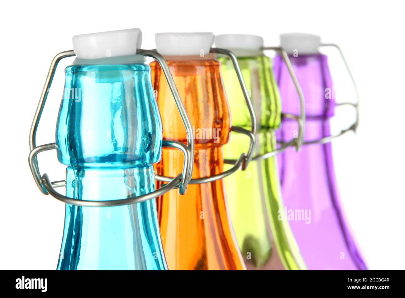 Colorful bottles isolated on white Stock Photo - Alamy