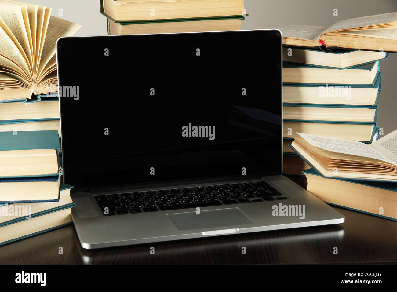 Notebook on books background Stock Photo - Alamy