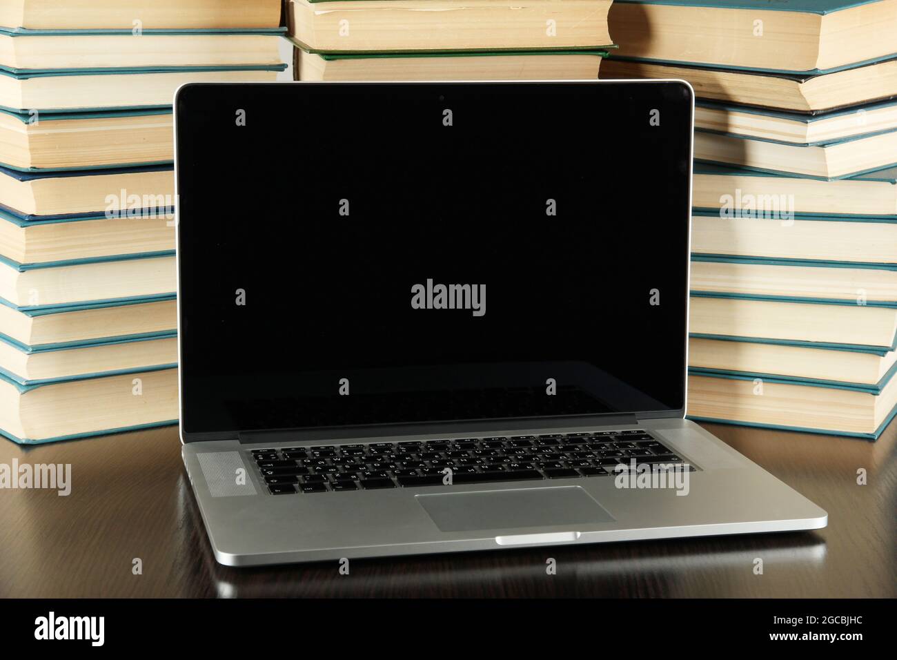 Notebook on books background Stock Photo - Alamy