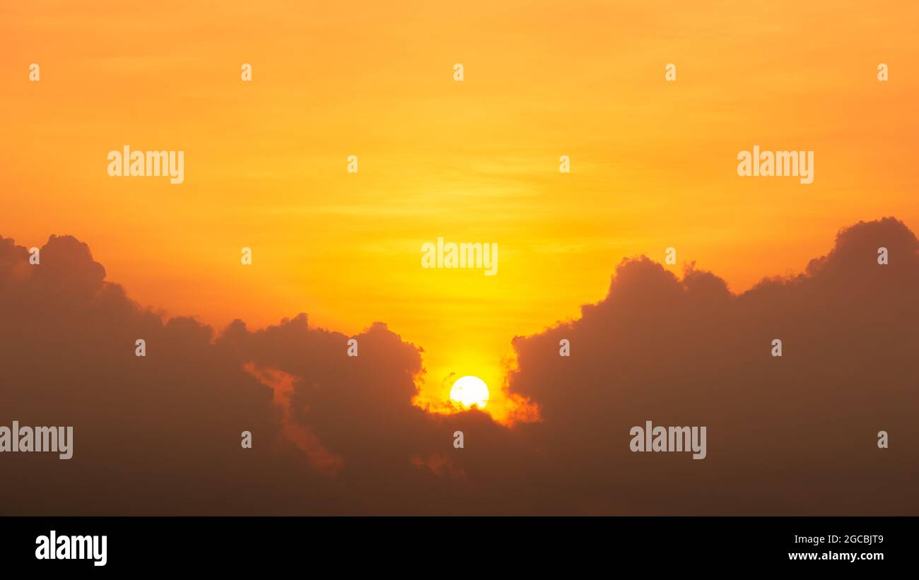 Brightness yellow sun rising above the clouds golden hour sky nature ...
