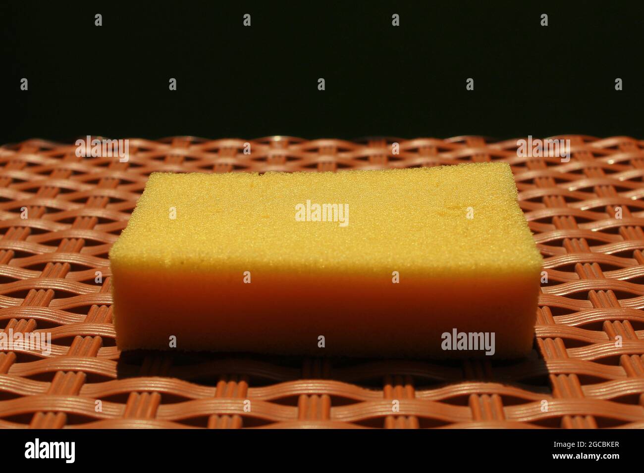 A cleaning sponge on the table Stock Photo - Alamy