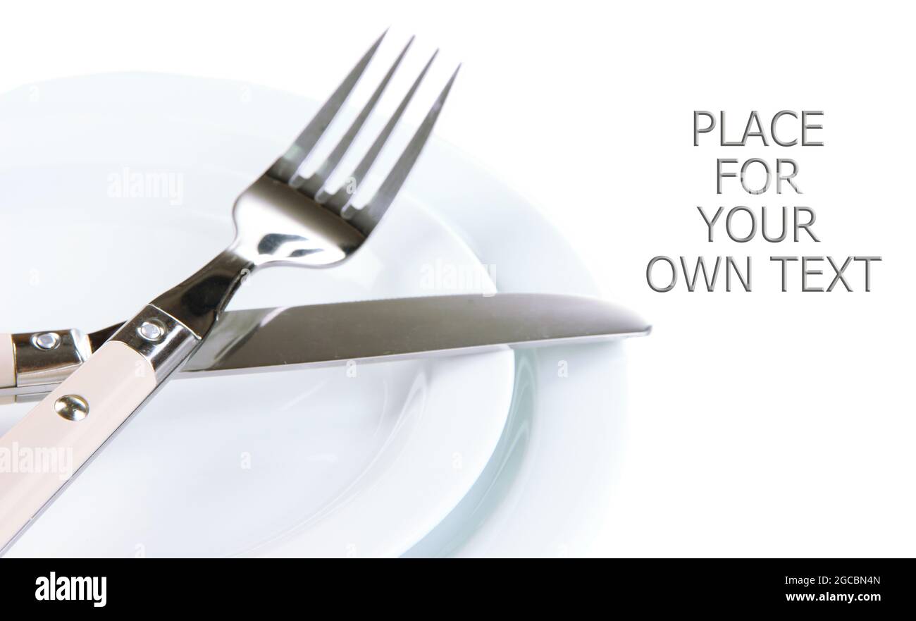 Knife, color plate and fork, isolated on white Stock Photo - Alamy