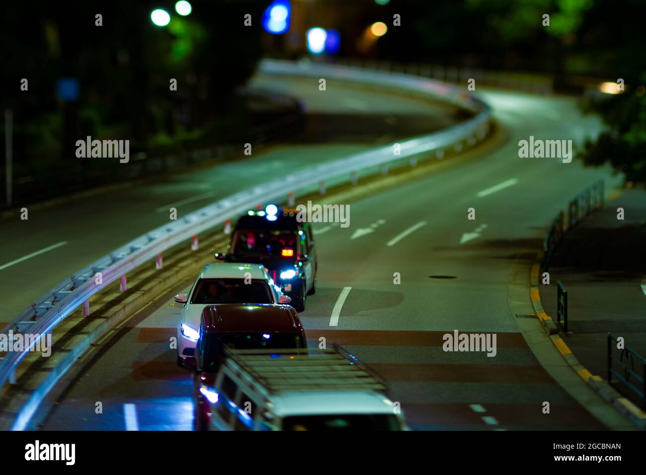 A night miniature traffic jam at the city street in Aoyama tiltshift ...