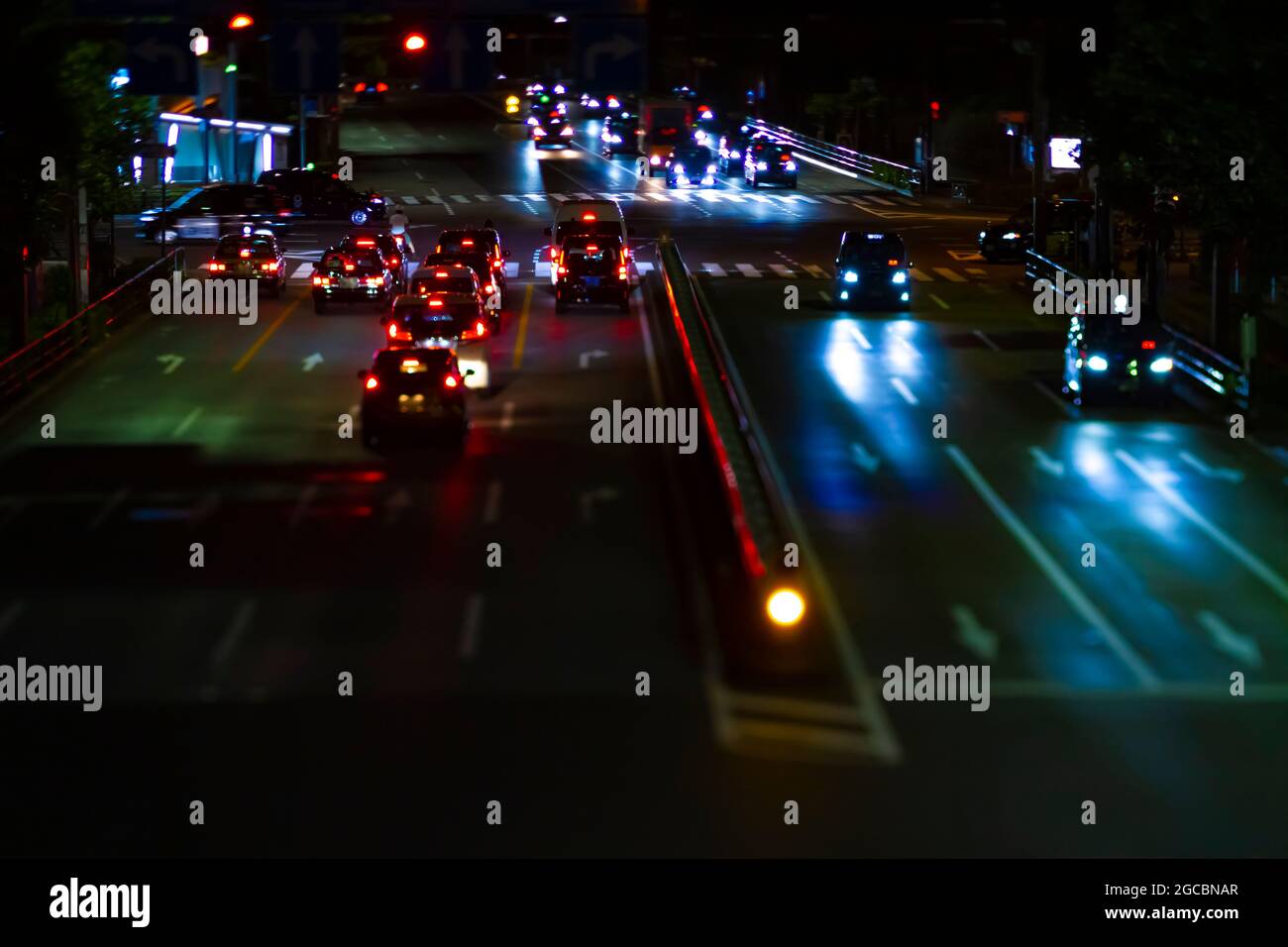 A night miniature traffic jam at the city street in Aoyama tiltshift ...