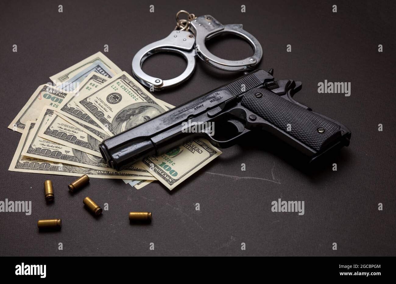 Crime and law concept. Pistol gun and bullets 9 mm, handcuffs and ...