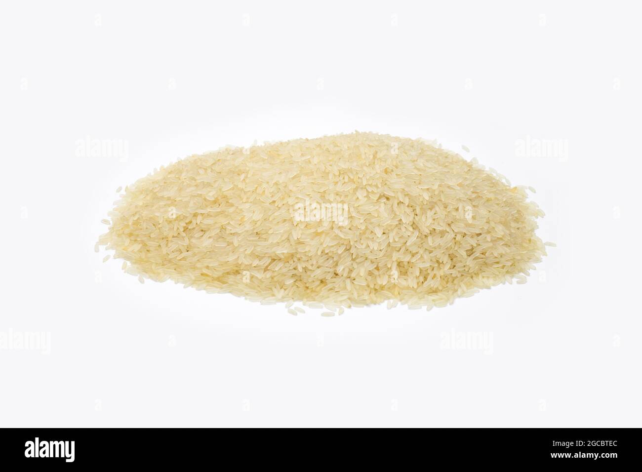 Uncooked dry rice pile on an isolated white background Stock Photo - Alamy