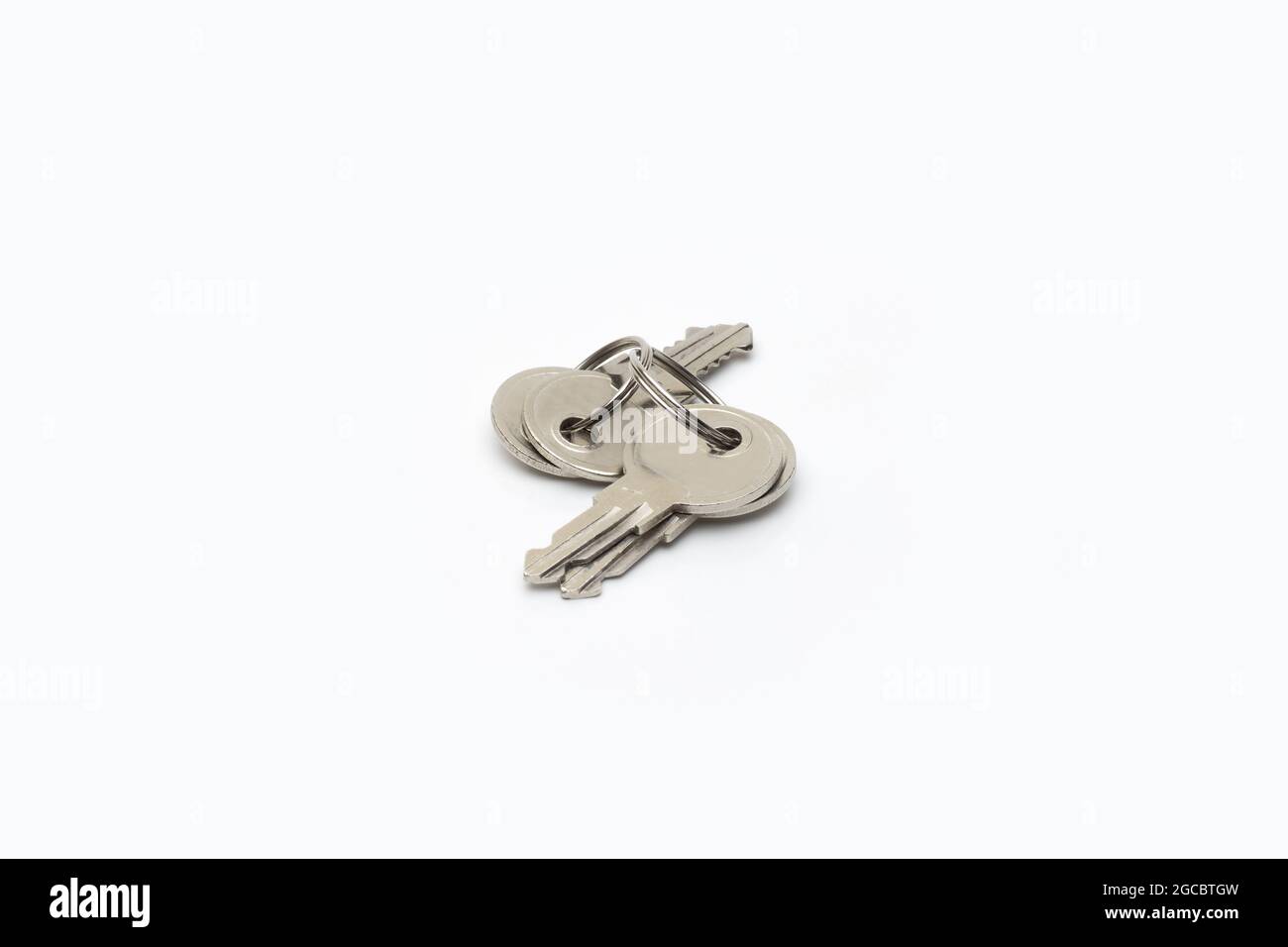 Isolated metal keys with rings on white background Stock Photo - Alamy