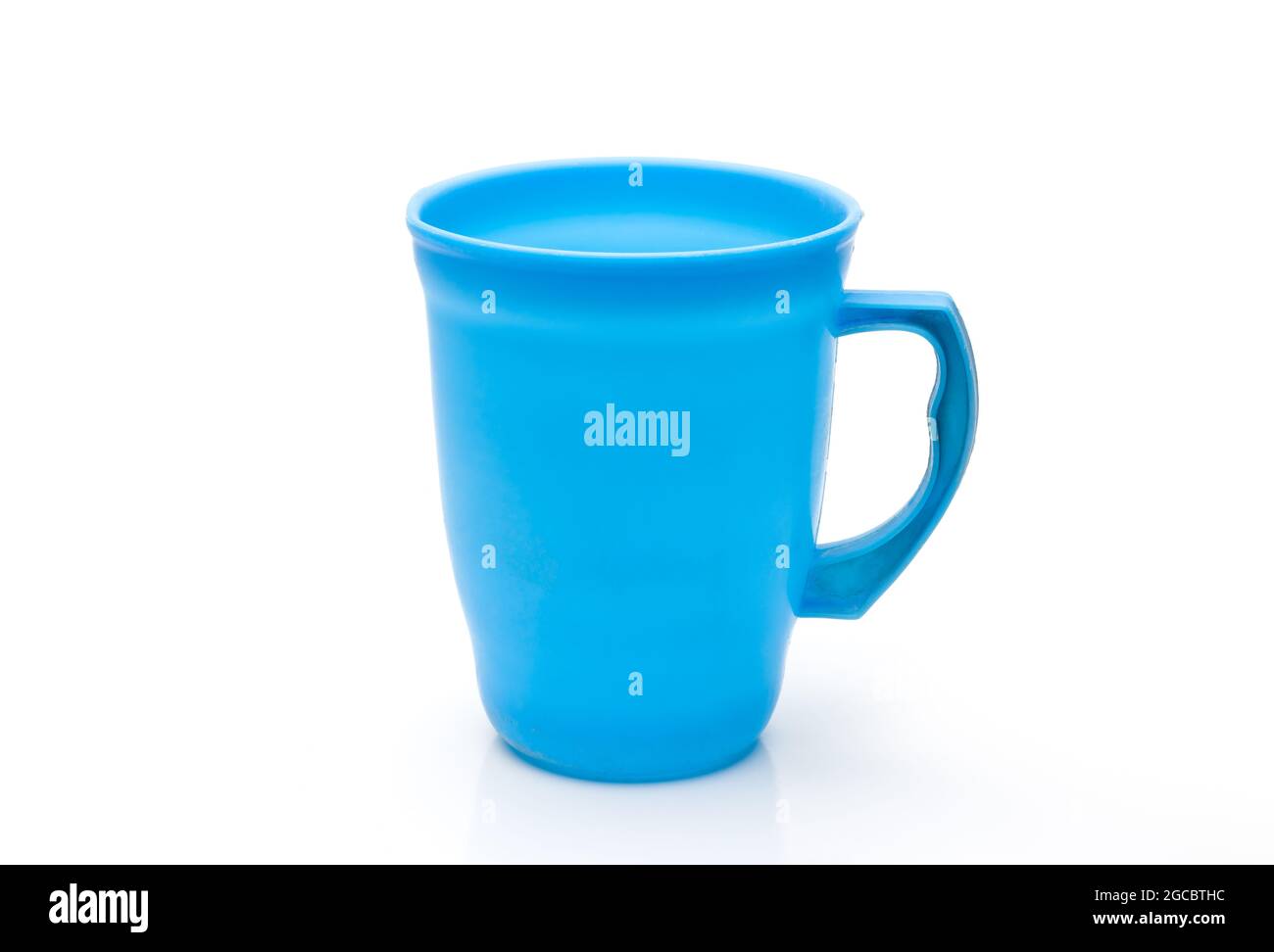 Blue color plastic glass or jug close up on isolated white background ...