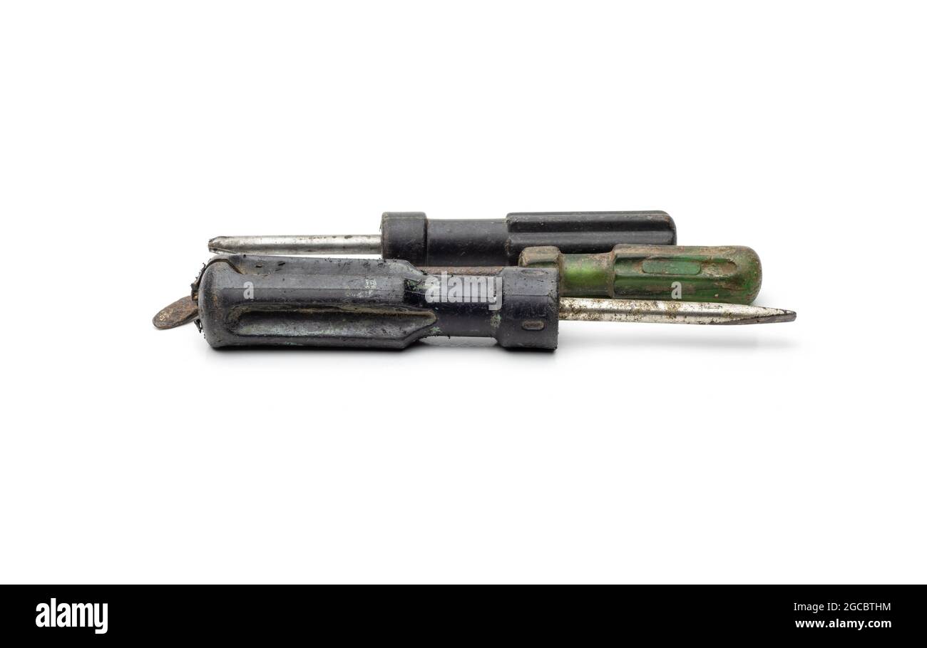 Old broken and distorted screwdrivers on an isolated white background ...