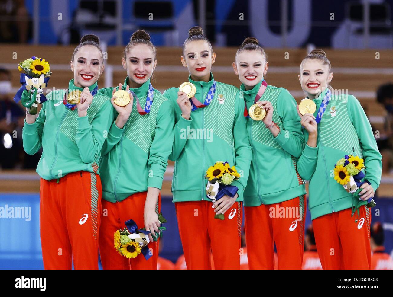 Athletes of the Bulgarian rhythmic gymnastics team pose with their gold ...