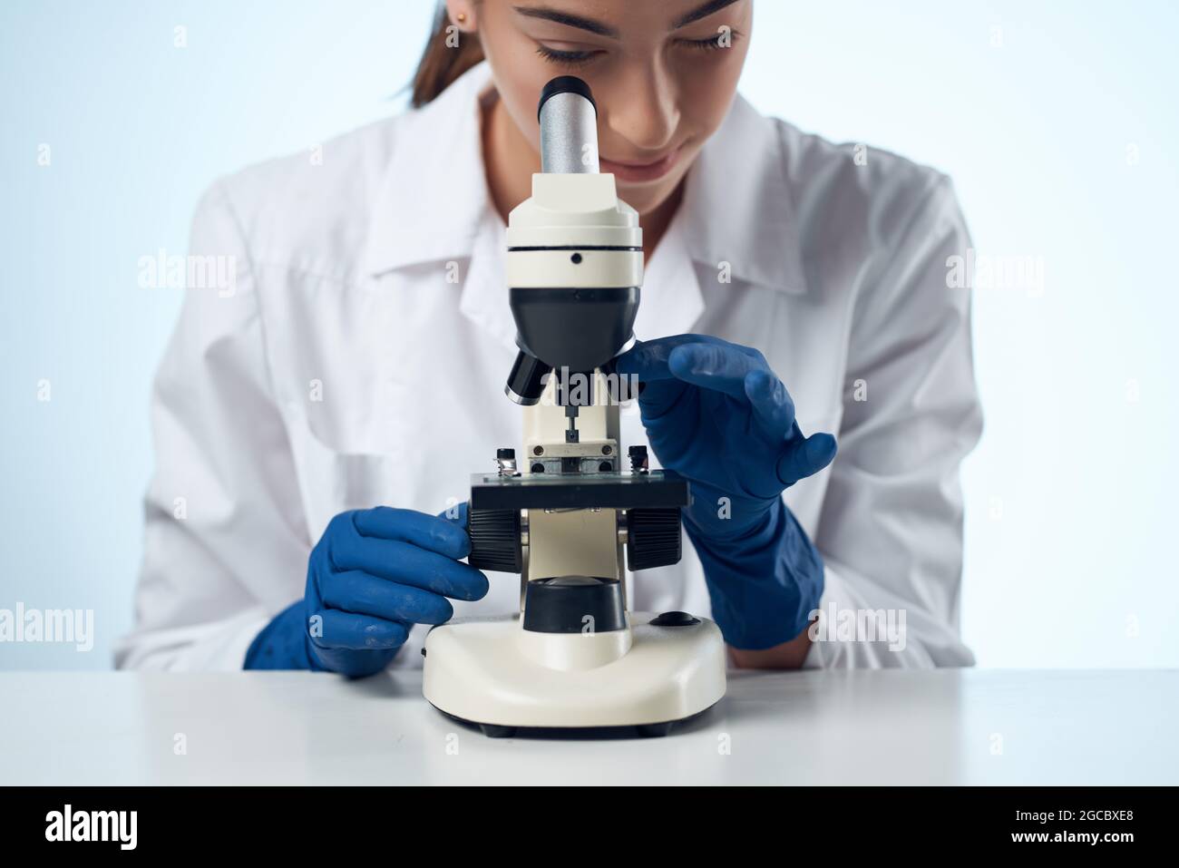 female doctor biology research technology laboratory microscope Stock ...