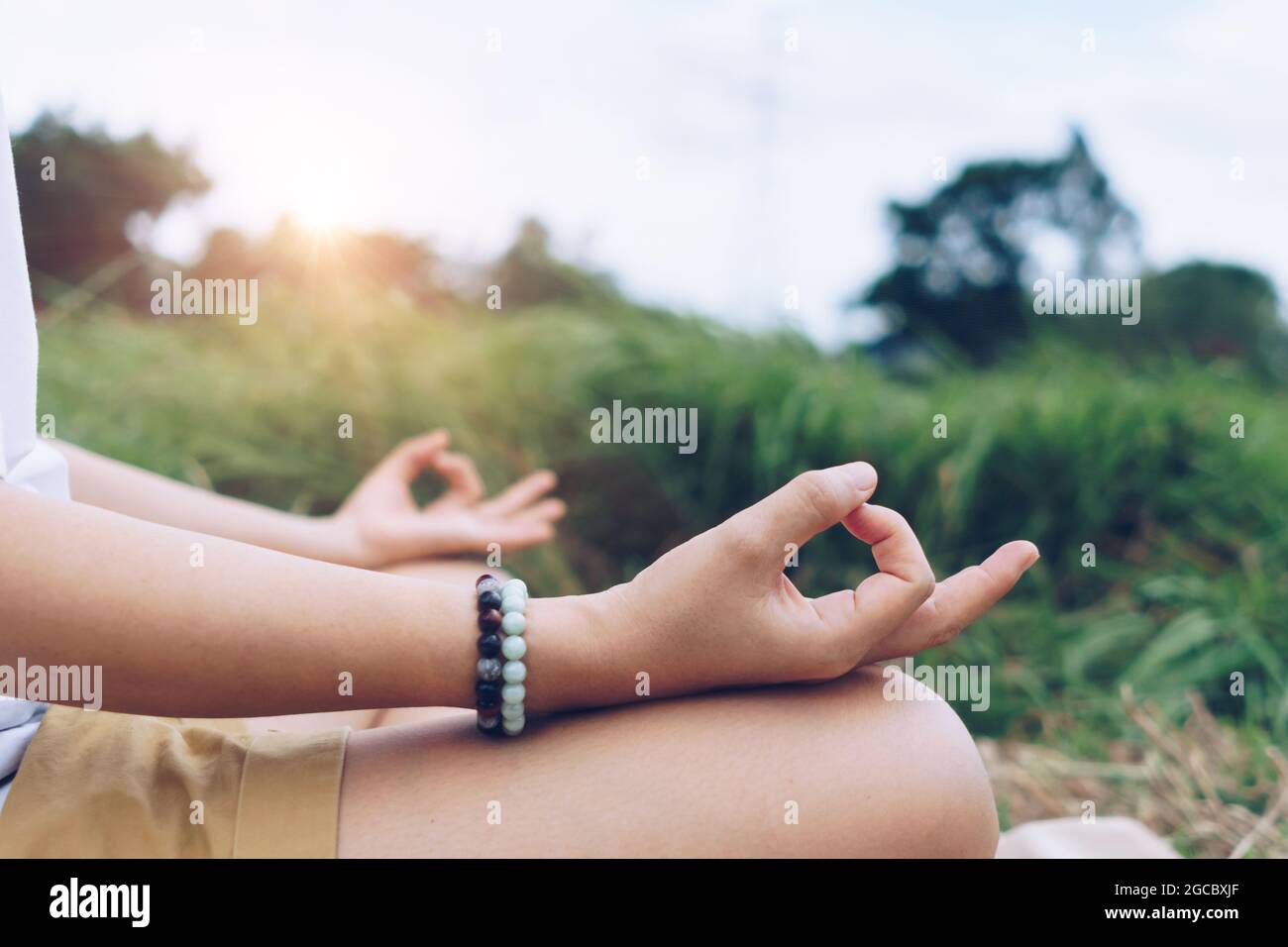 Woman practicing yoga lesson, breathing, meditating exercise, outdoor ...