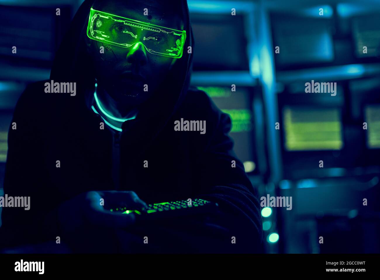 Cyber hacker breaks into databases to obtain information using a computer. Cybercrime and data ...