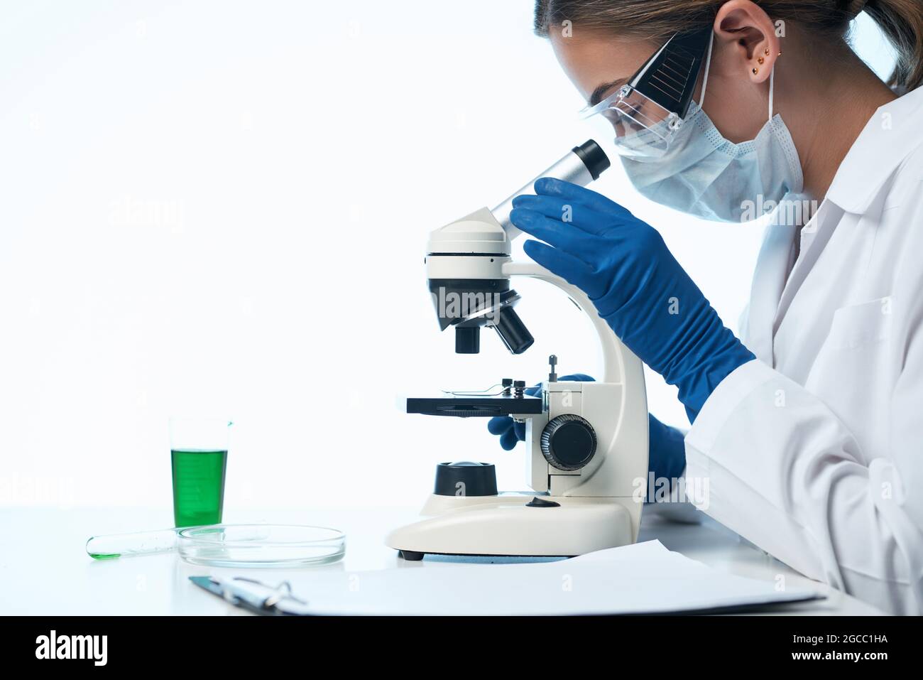 female doctor laboratory research microscope biotechnology professional ...