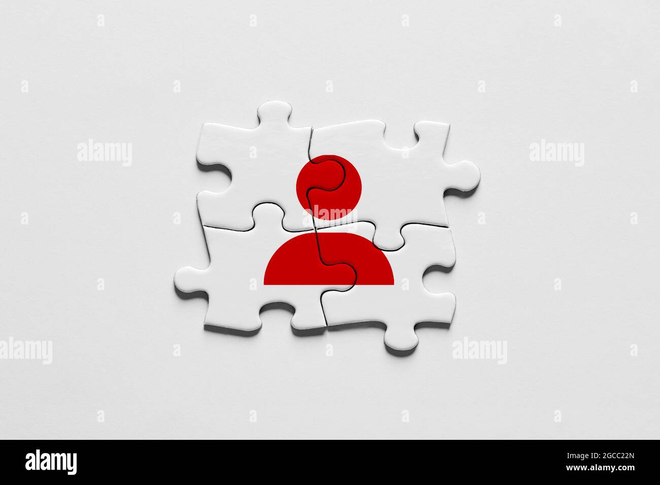 Jigsaw puzzle pieces connect to each other and form an employee or user ...