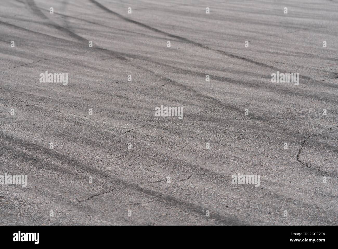 Asphalt with black rubber marks from tyres, abstract photo Stock Photo ...