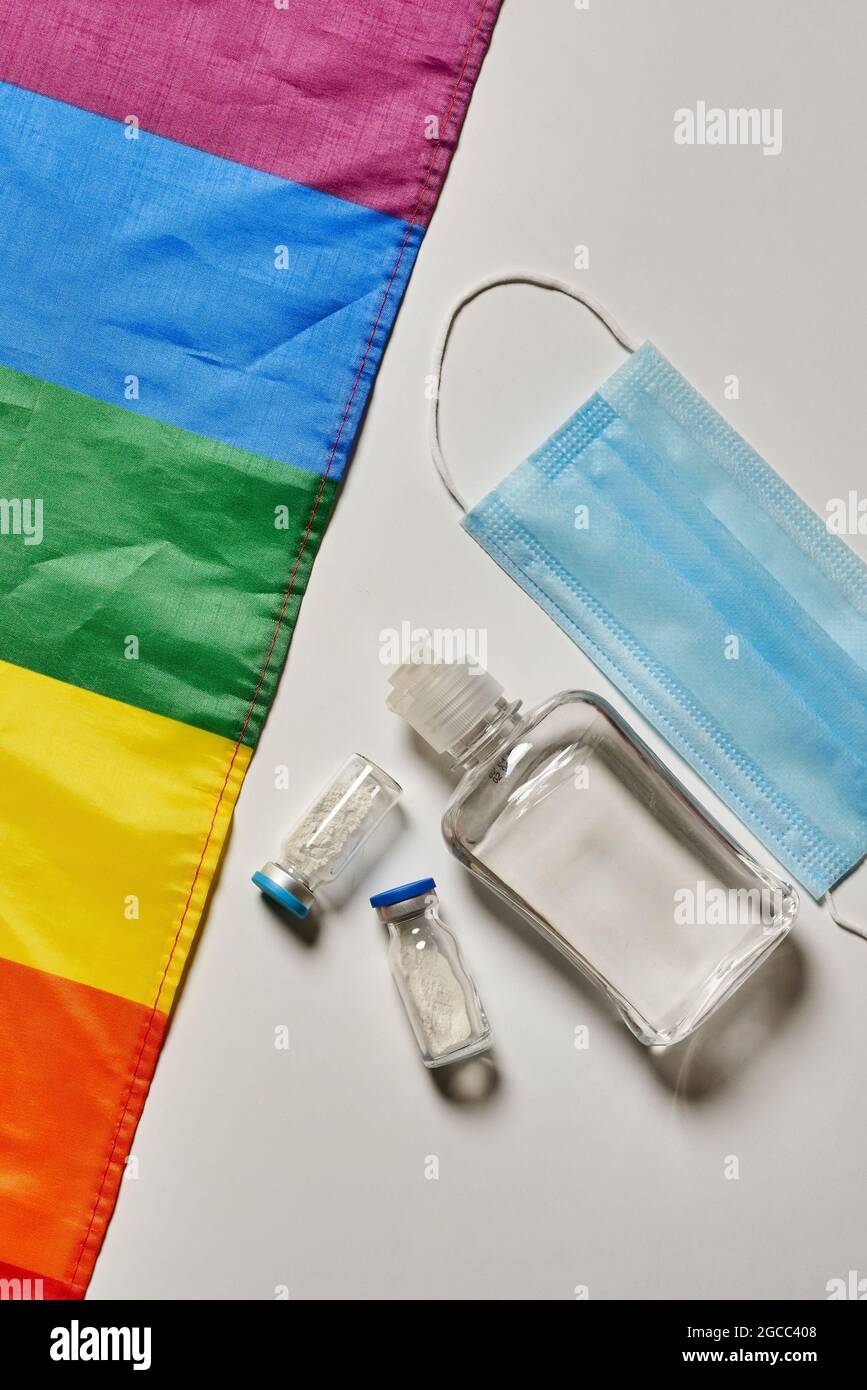 LGBT rainbow flag and COVID-19 personal hygiene items - face mask ...