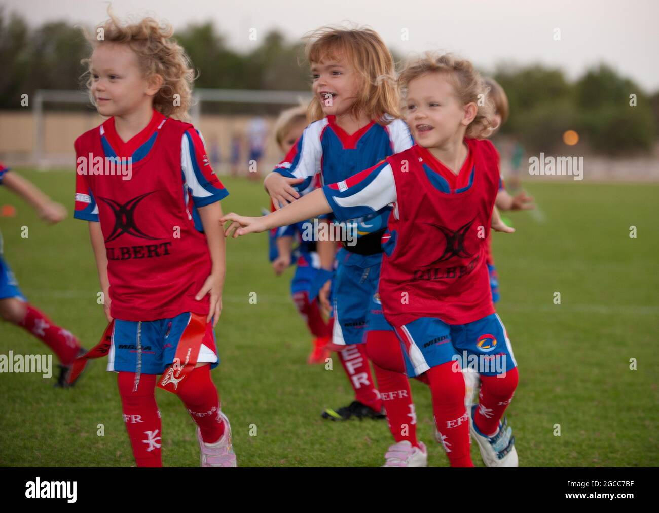 young kids playing rugby in abu dhabi Stock Photo - Alamy